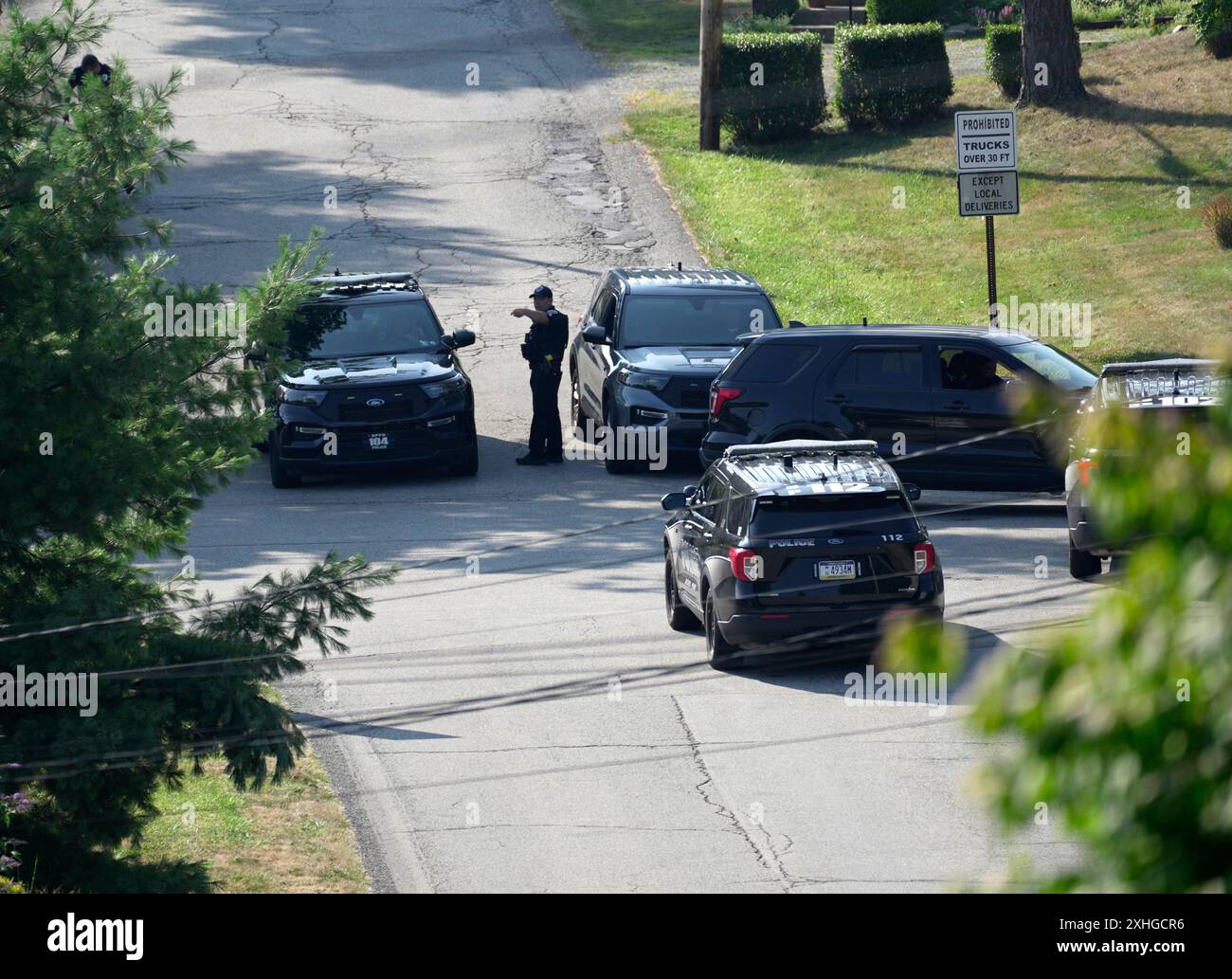 Law enforcement block a street in Bethel Park, Pa., that they say had a ...