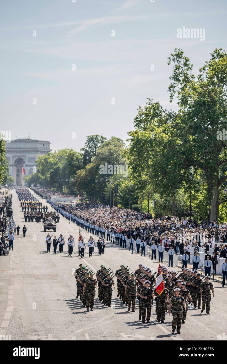 Troops march during the Bastille Day military parade along the Avenue ...