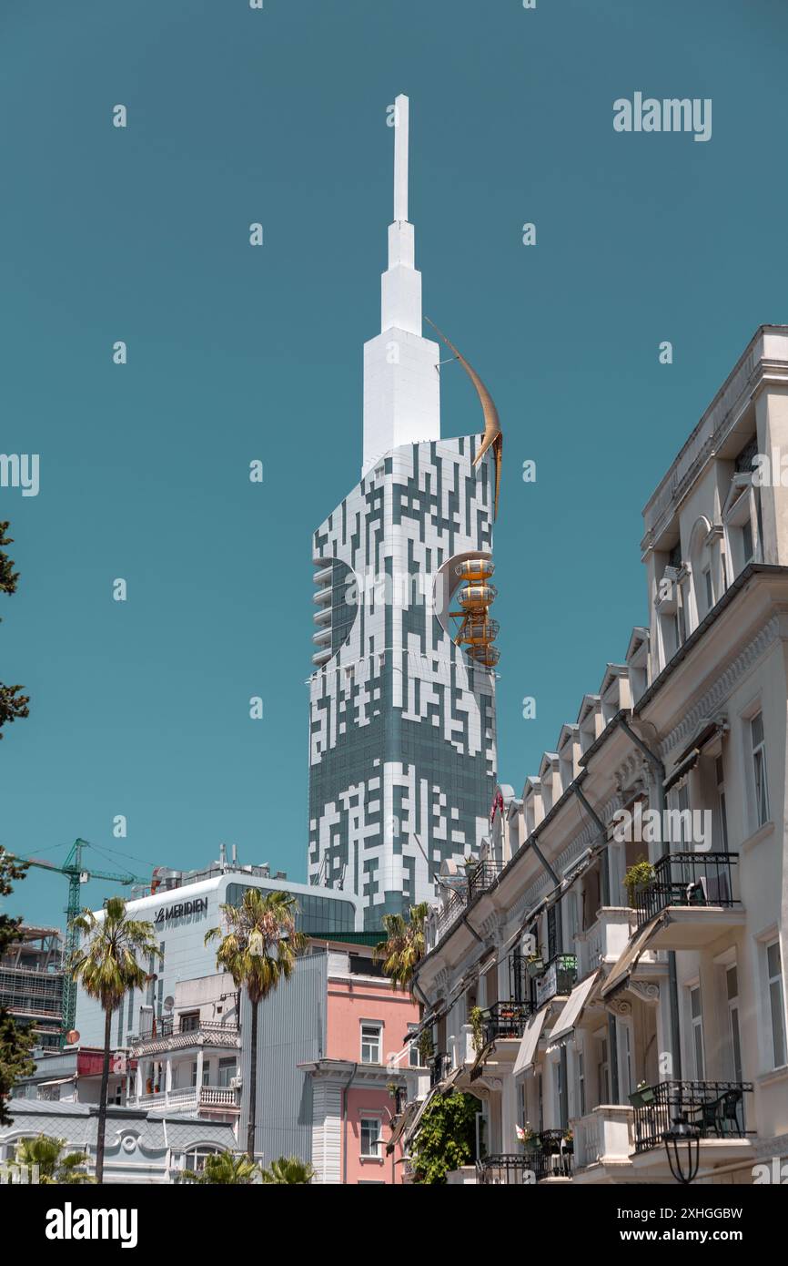 The coastline of Batumi in the sunset, Georgia. Umbrella statue on the ...
