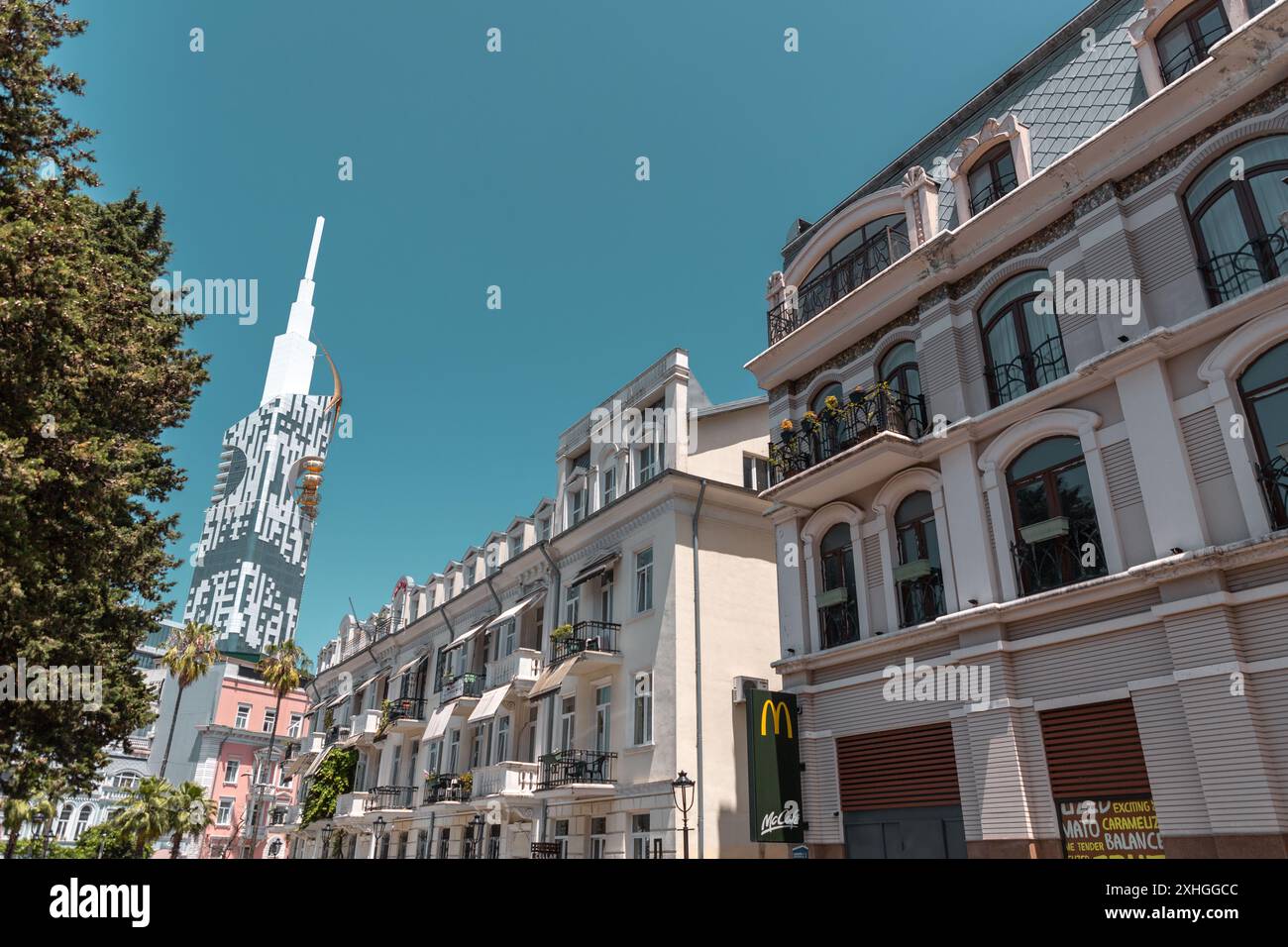 The coastline of Batumi in the sunset, Georgia. Umbrella statue on the ...