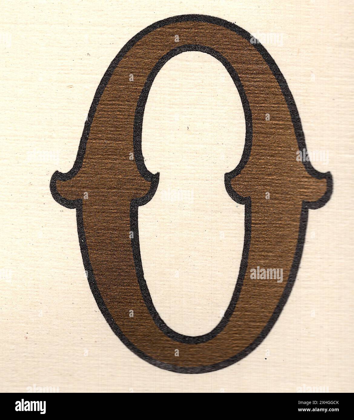 A decorative antique capital letter O in gold with a black outline on a ...