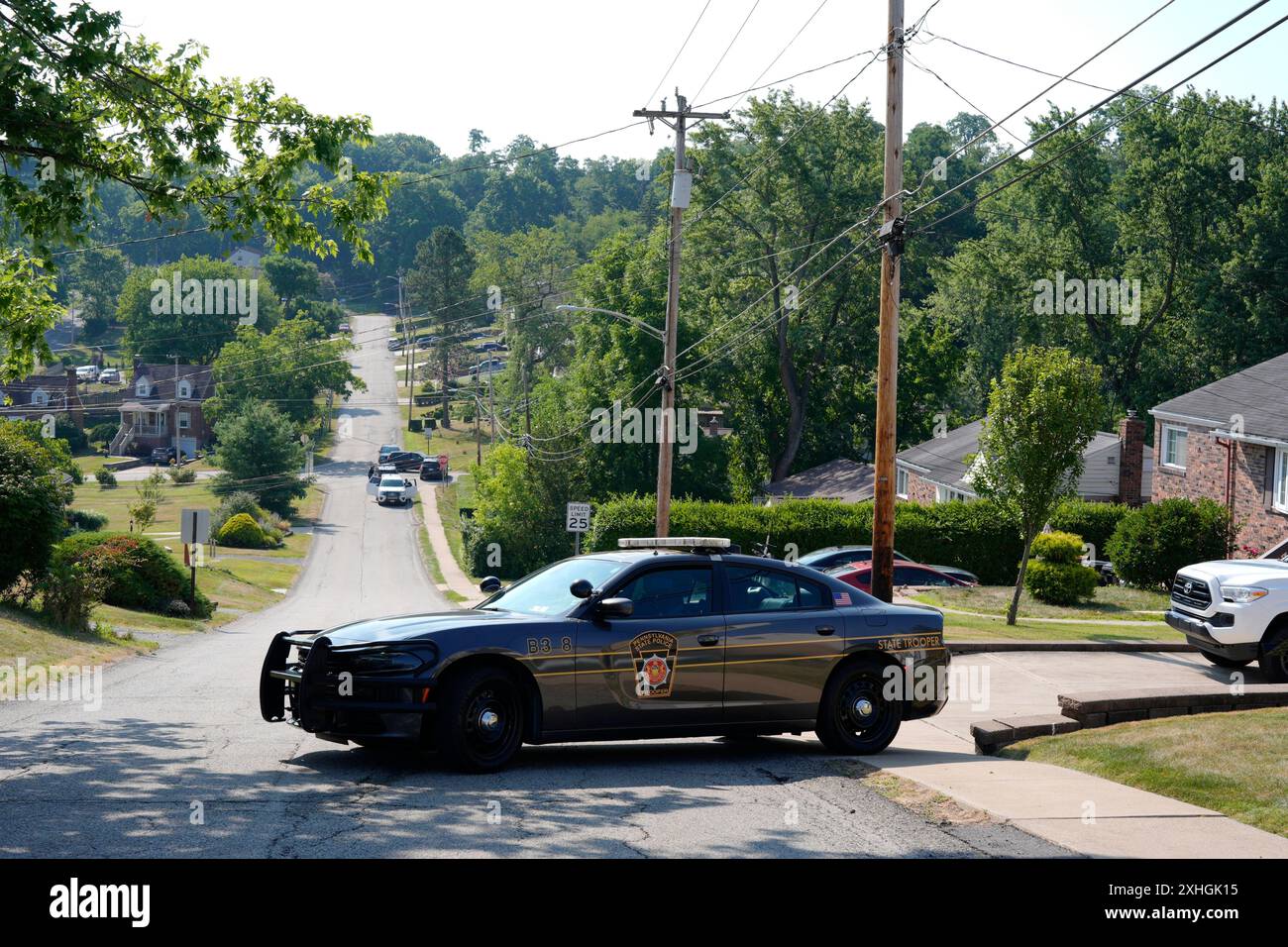 Law enforcement block a street in Bethel Park, Pa., that they say is ...