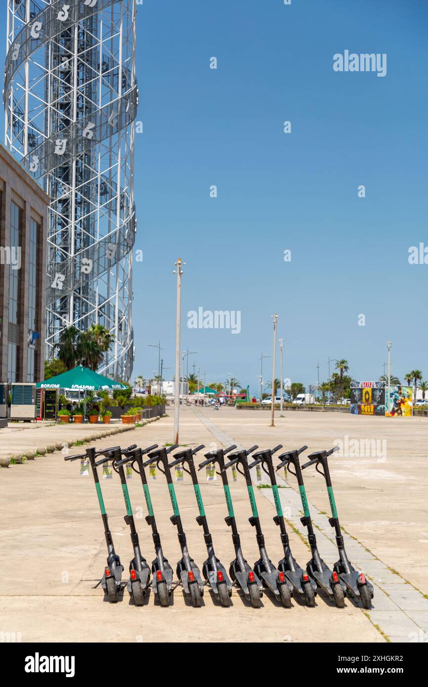 Batumi, Georgia - 13 JUNE 2024: Row of electric scooters parked near ...