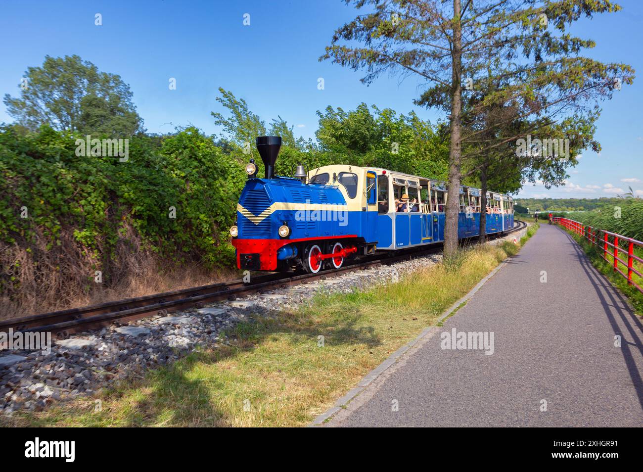 Poland, Poznan - July 6, 2024: A mini steam locomotive with passengers ...