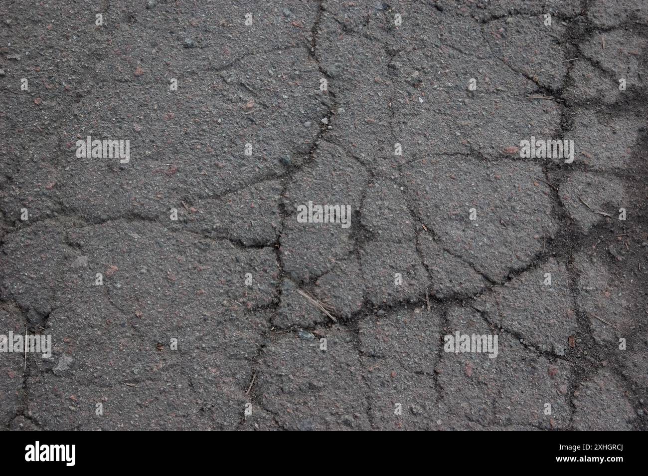 an old cracked asphalt pathway Stock Photo - Alamy