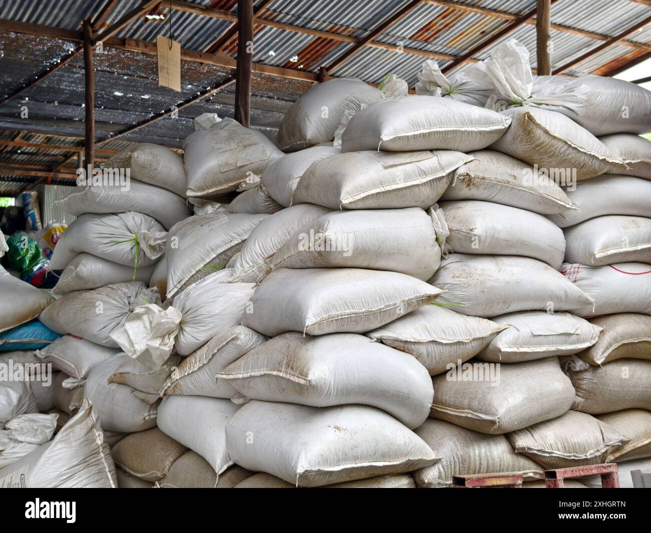 Stacking of big white bags in the modern warehouse Stock Photo - Alamy