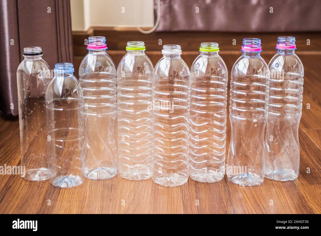 set of many plastic bottles on wood floor, recycling concept Stock ...
