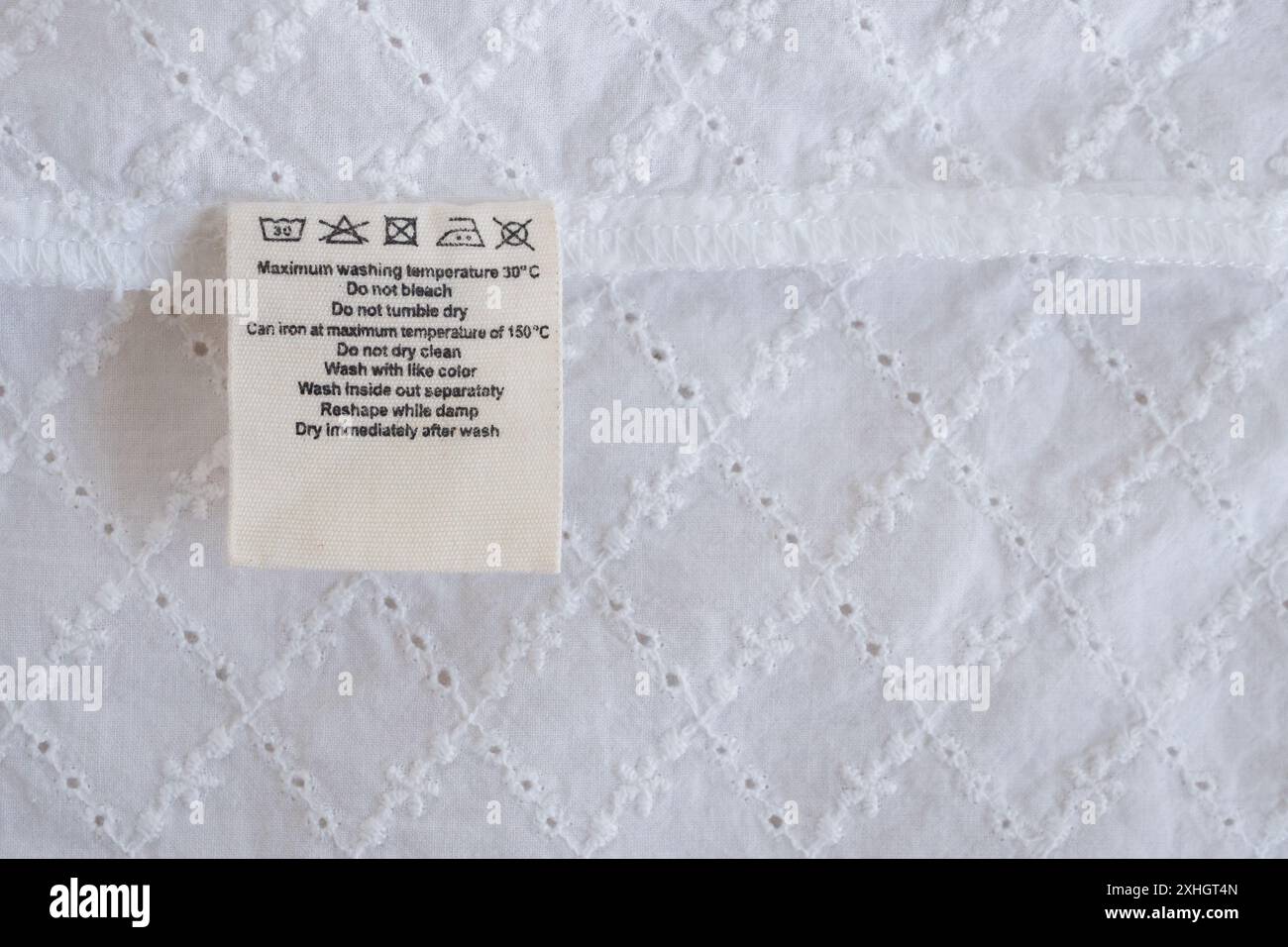 laundry care washing instructions clothes label on fabric texture ...