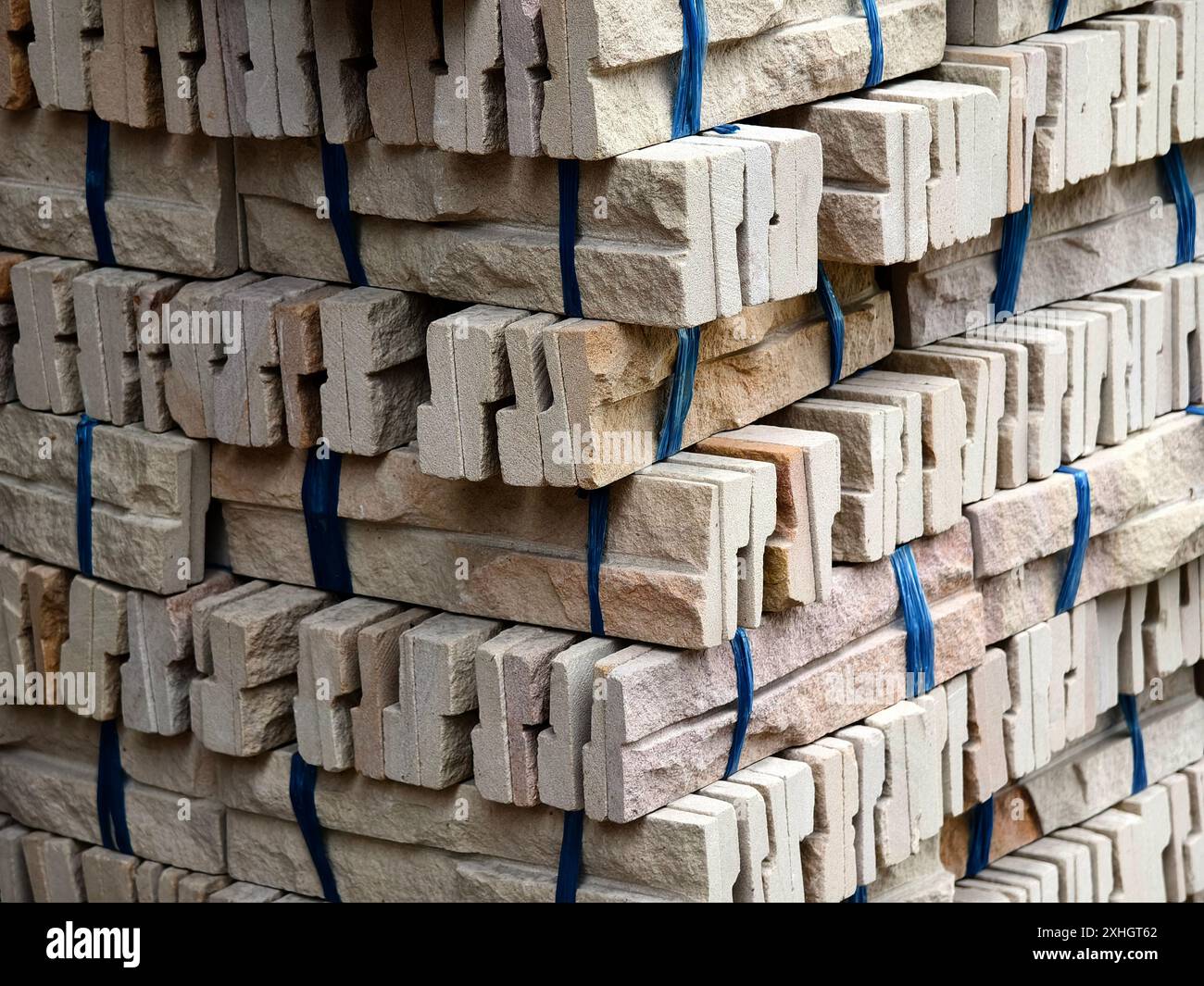 Brick stack tied with ropes for construction and building purposes ...