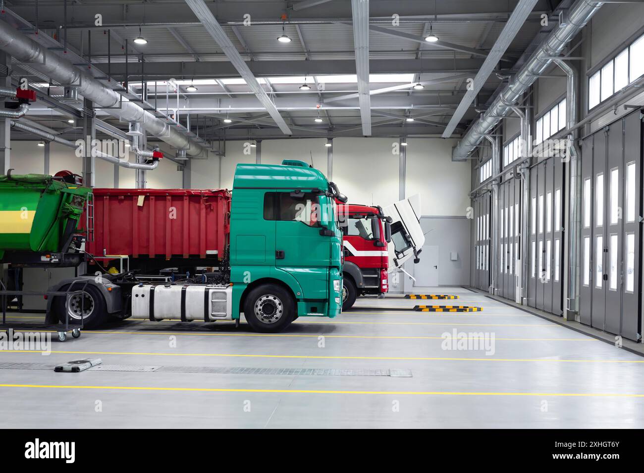 Trucks being repaired in a larger garage. Service maintenance of trucks ...
