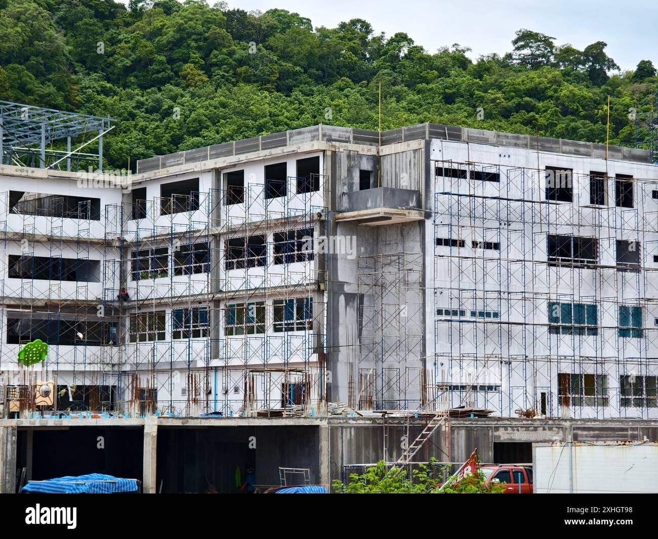 A tall building with numerous windows is being built Stock Photo - Alamy