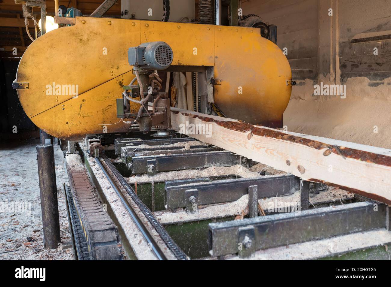 Processing wooden boards at a sawmill. The process of processing logs ...