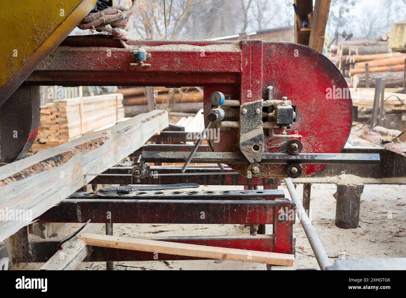 The process of processing wooden boards at a sawmill. Sawing and drying ...