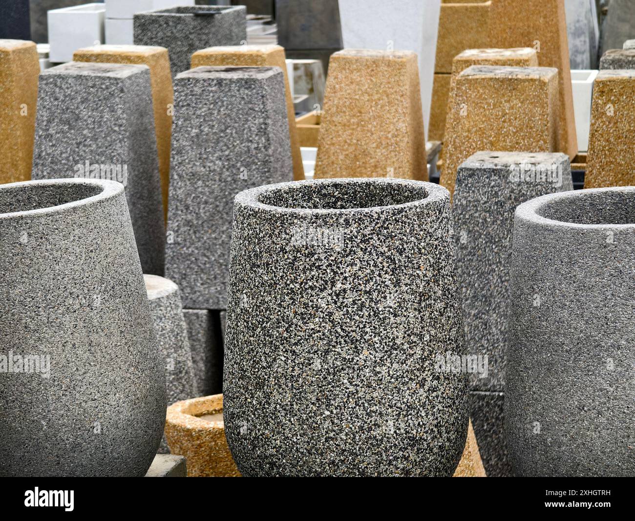 Several concrete plant pots are stacked on top of each other Stock ...
