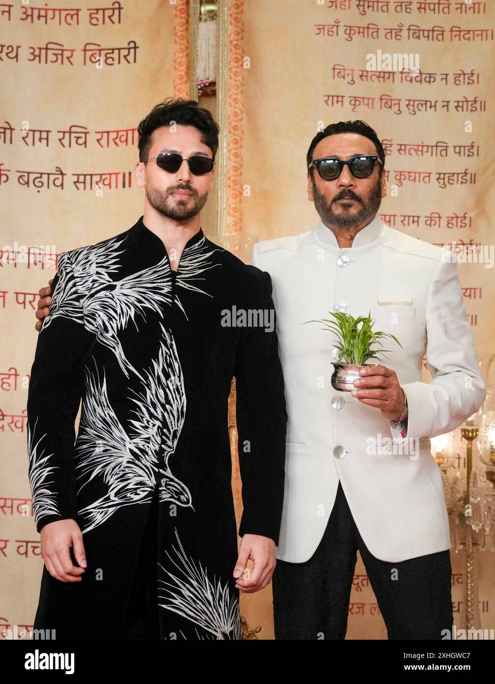 Indian actor Jackie Shroff poses for a photograph with his son Tiger ...