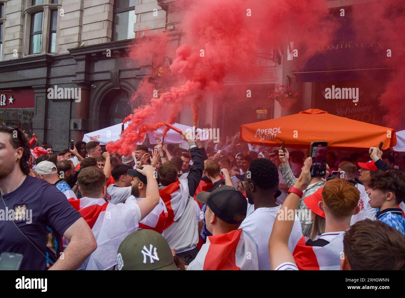 London, UK. 14th July 2024. England fans set off smoke flares outside ...