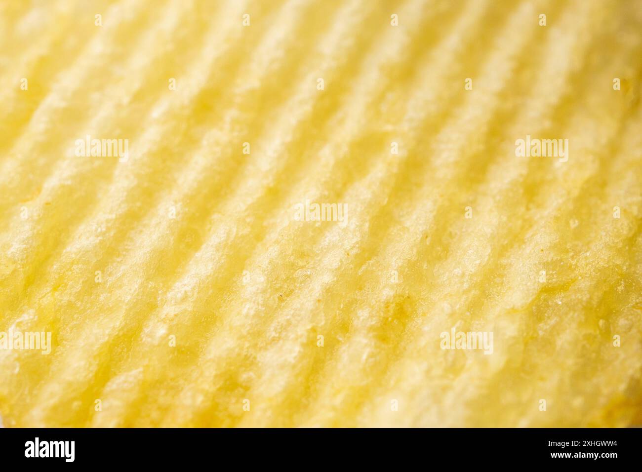 Potato chip pattern texture background closeup Stock Photo - Alamy