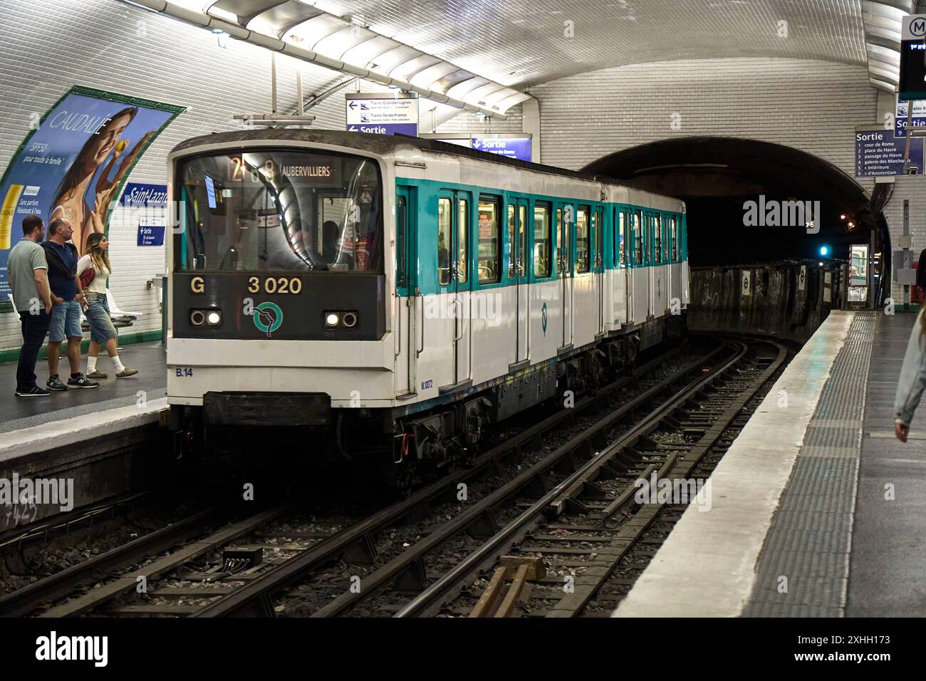 Paris, France - July 13, 2024: A metro train in Paris approaches the ...