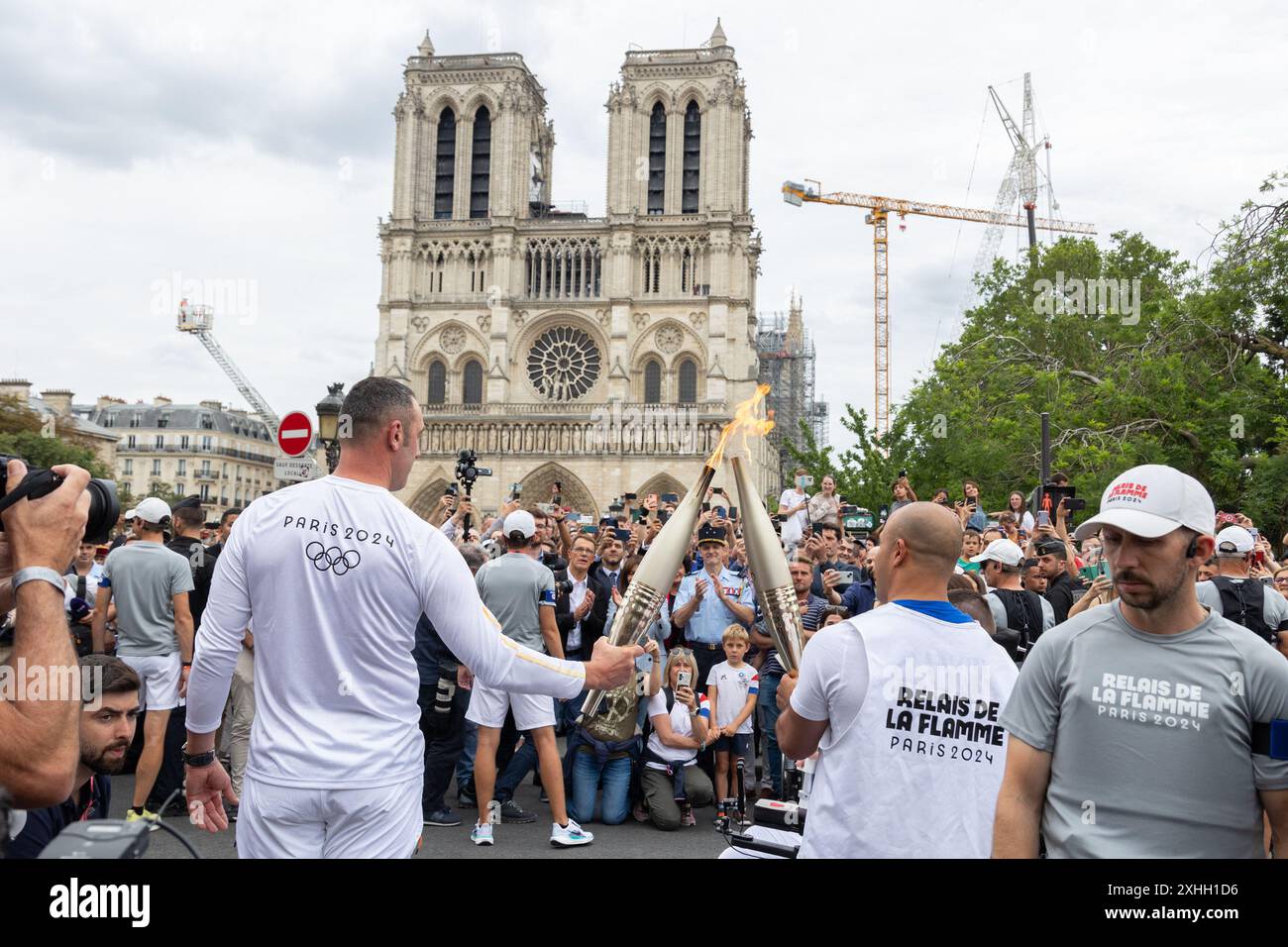 The Olympic torch travels front of Notre Dame of Paris as part of the ...