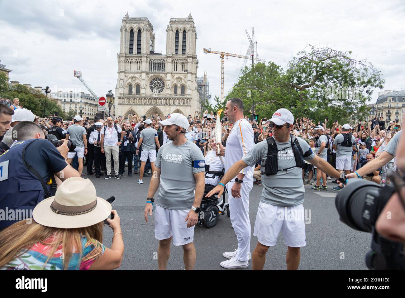 The Olympic torch travels front of Notre Dame of Paris as part of the ...