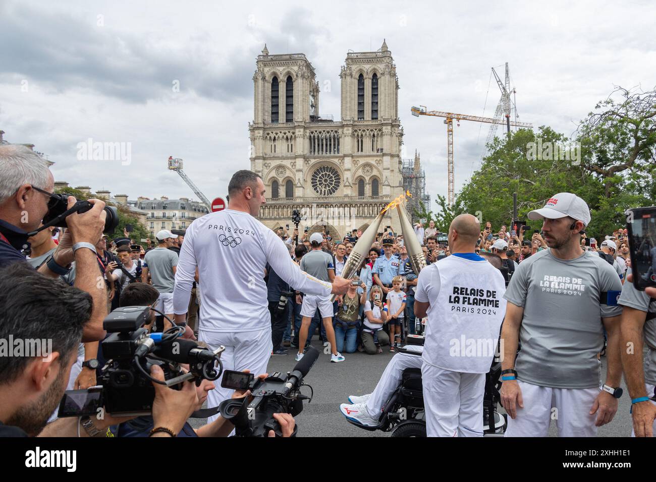 The Olympic torch travels front of Notre Dame of Paris as part of the ...