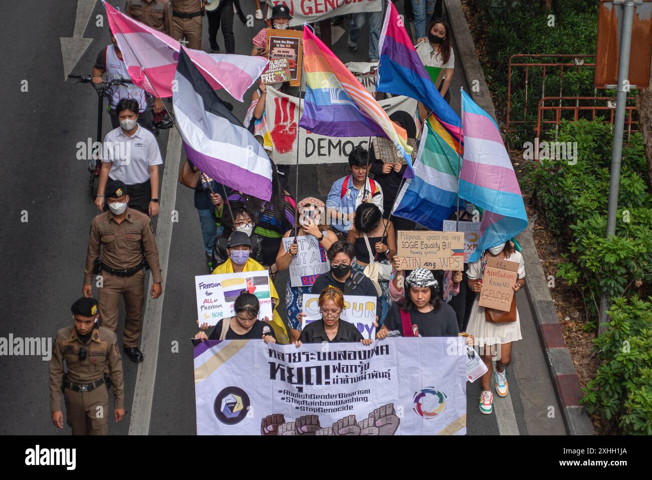 Participants seen marching along the road during the demonstration. The ...