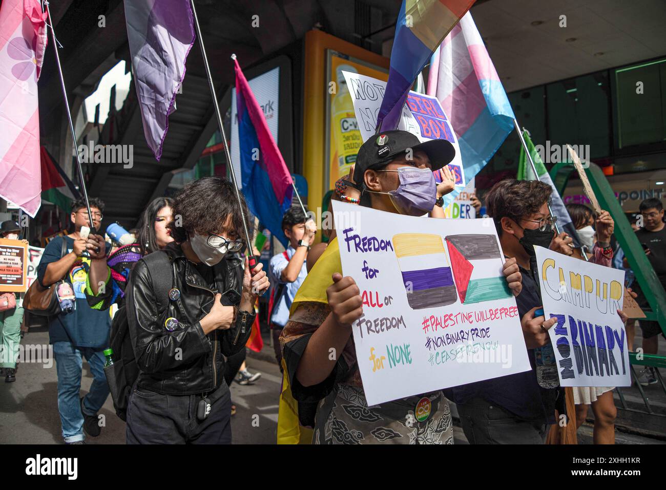 Participants hold placards expressing their opinions while marching ...