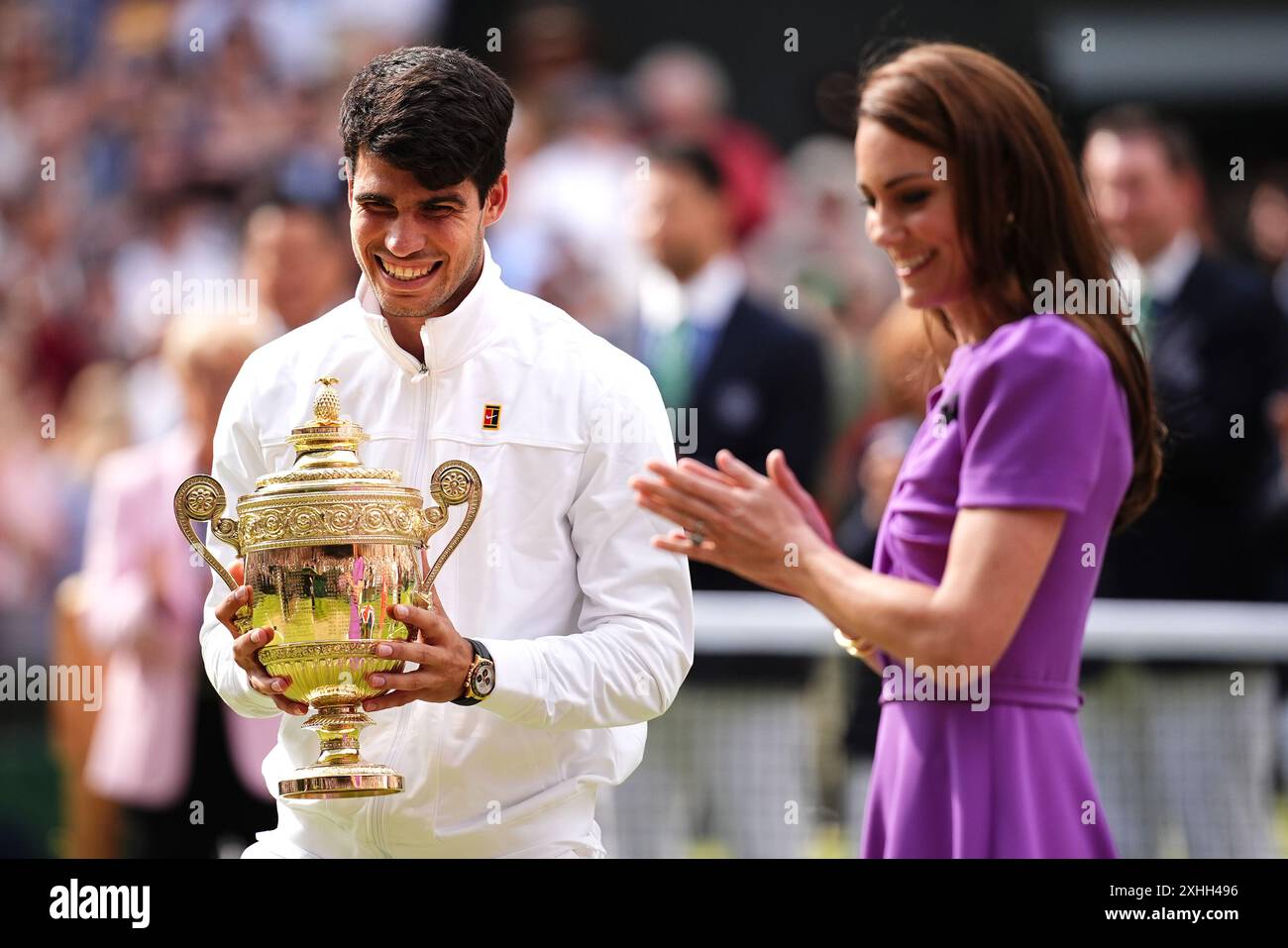 Carlos Alcaraz (left) is presented with the trophy by the Princess of ...