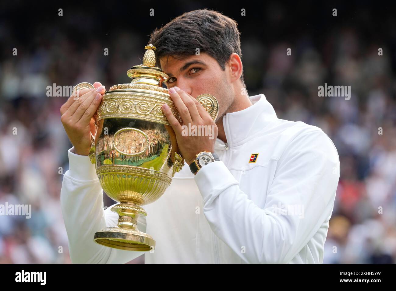 Carlos Alcaraz of Spain kisses his trophy after defeating Novak ...