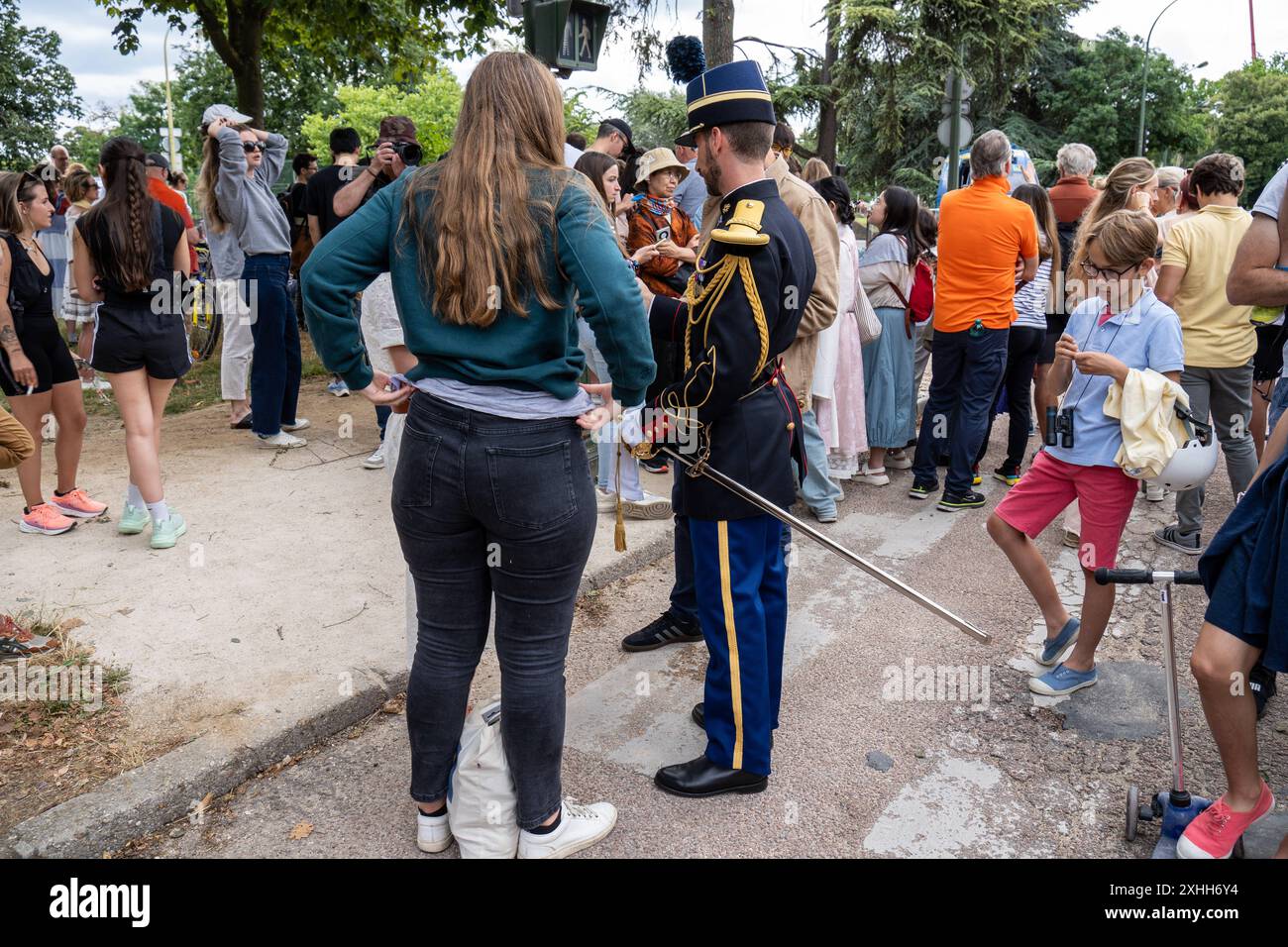 Paris, France - July 14, 2024: Crowd at the national holiday in Paris ...