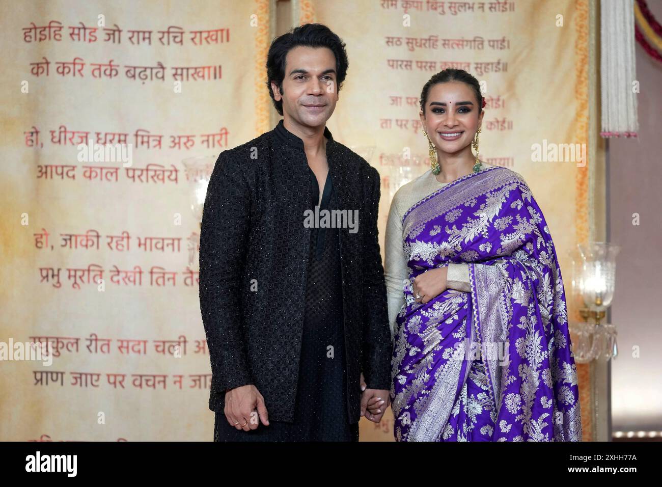 Indian actor Rajkummar Rao poses for a photograph with his wife ...