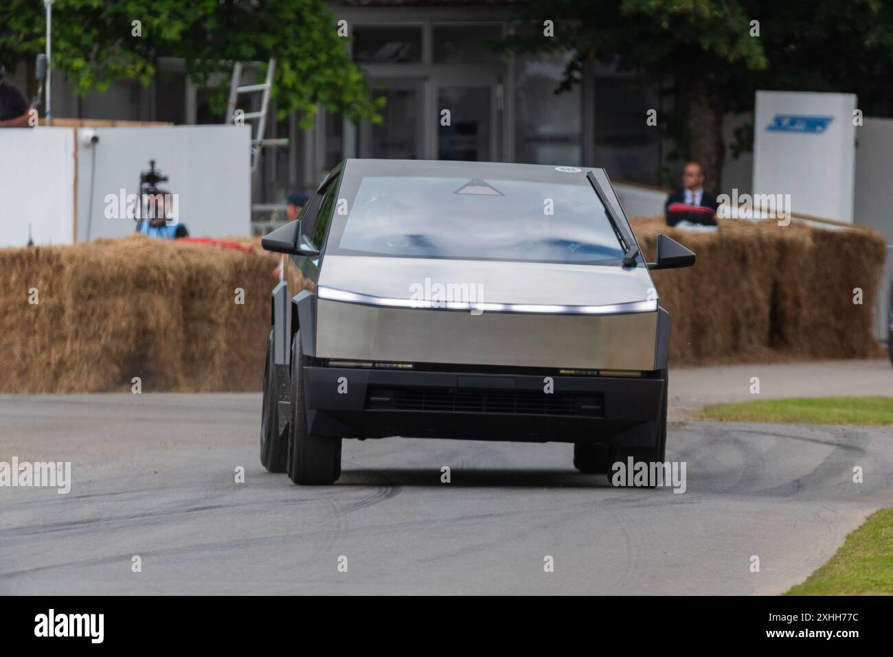 Tesla Cybertruck electric pickup truck driving up the hill climb track ...
