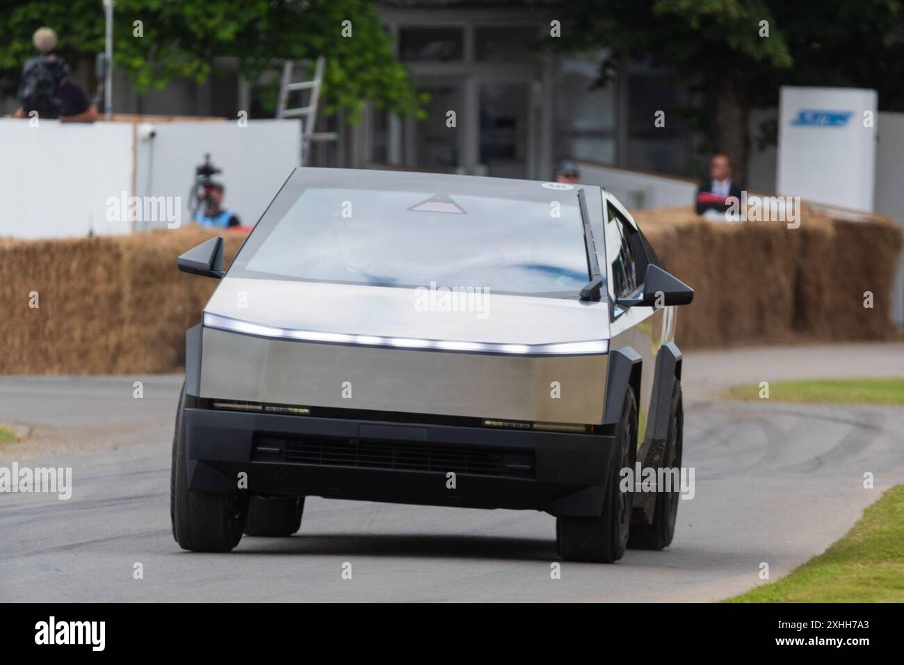 Tesla Cybertruck electric pickup truck driving up the hill climb track ...