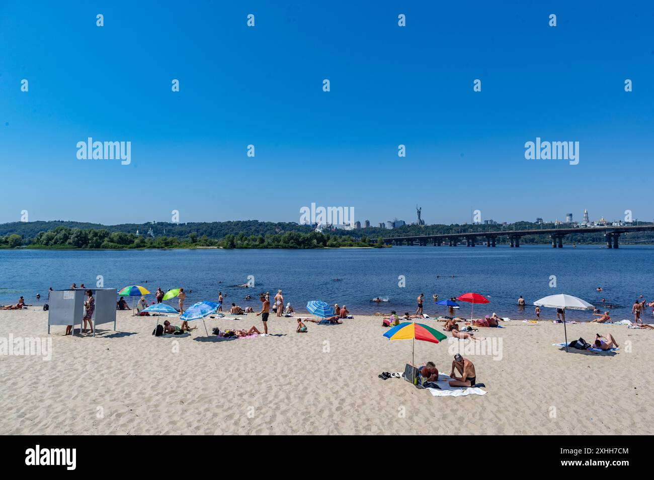 People took to the Dnipro River beaches in the capital, Kyiv, Ukraine ...