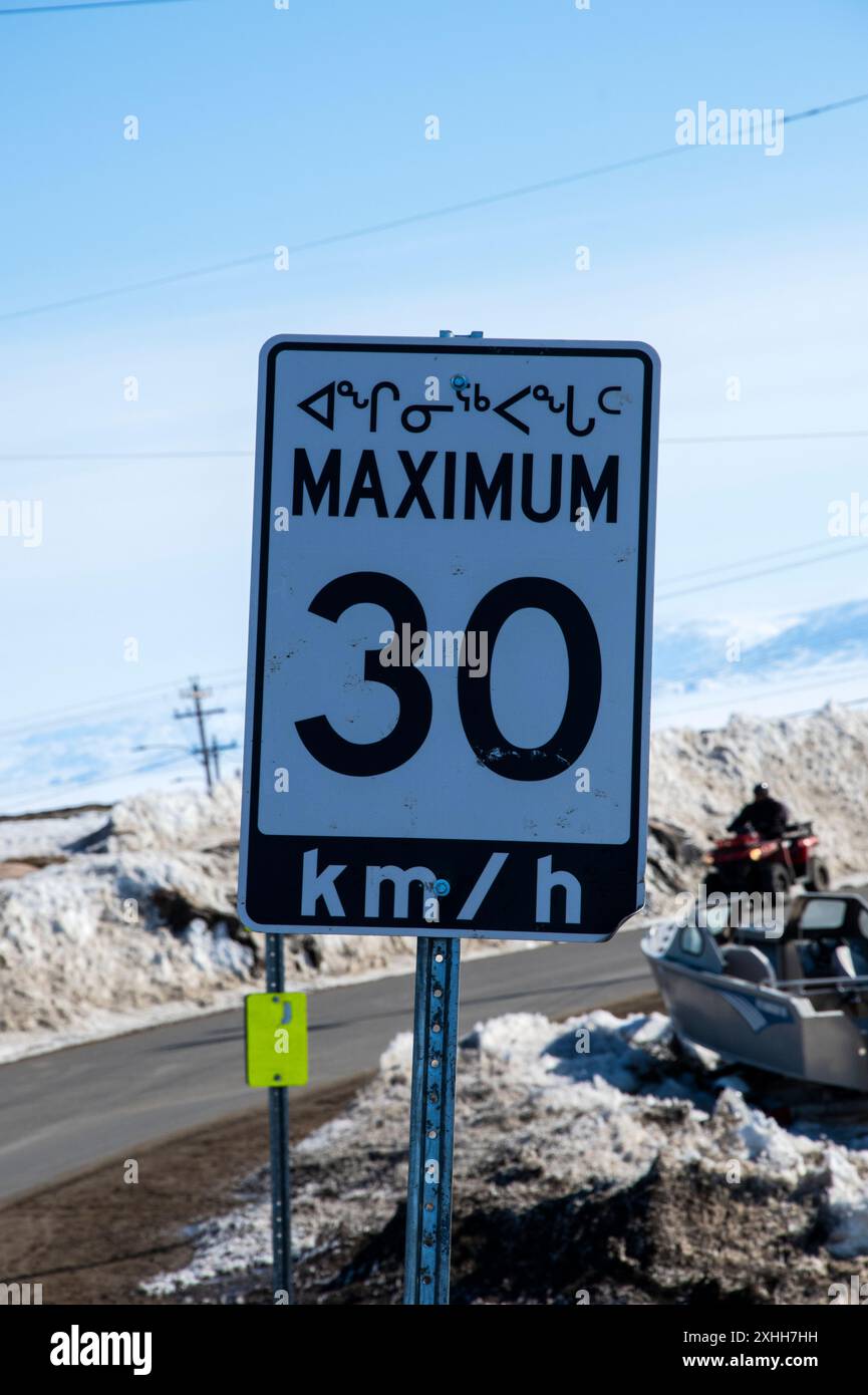 Bilingual speed limit traffic sign in English and Inuktitut in Iqaluit ...