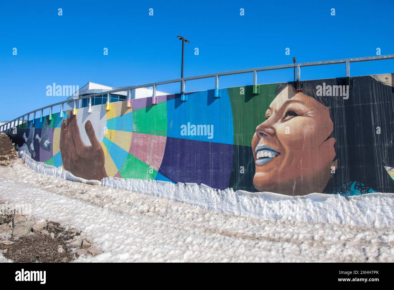 Inuit woman embracing mural under the theme of "Come Together" at ...
