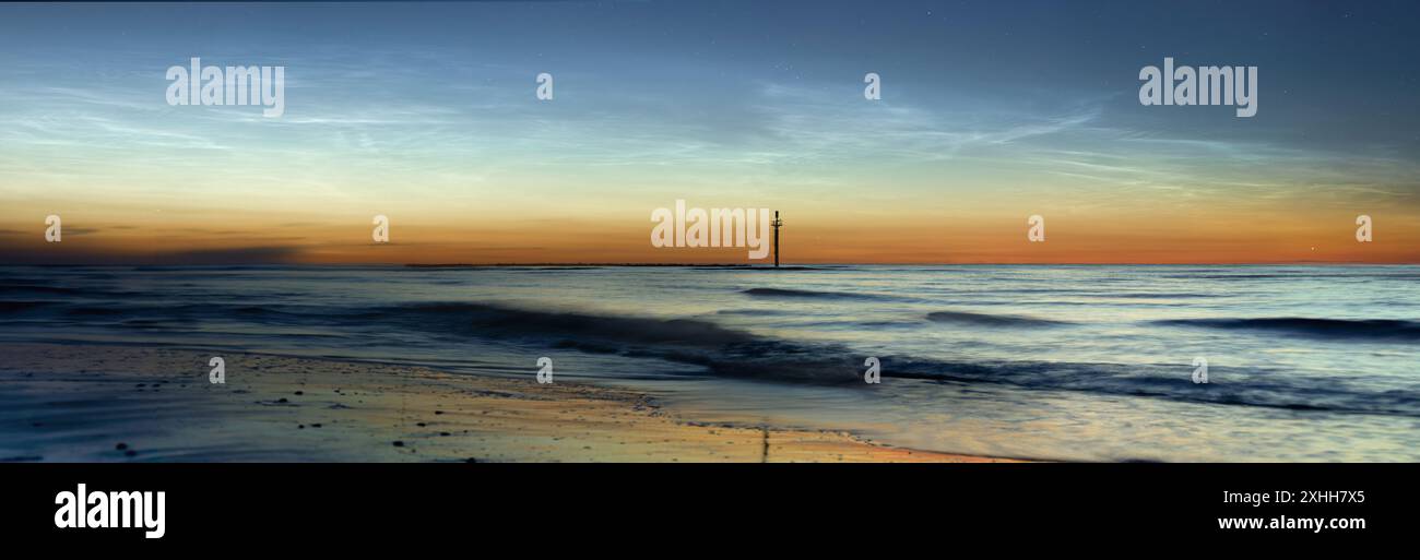 Rare Noctilucent clouds seen at night over Waxham beach, Norfolk Stock ...