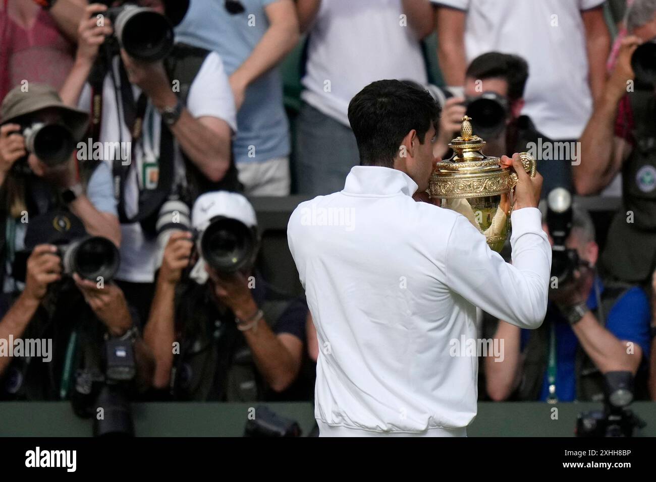 Carlos Alcaraz of Spain poses for the photographers with his trophy ...