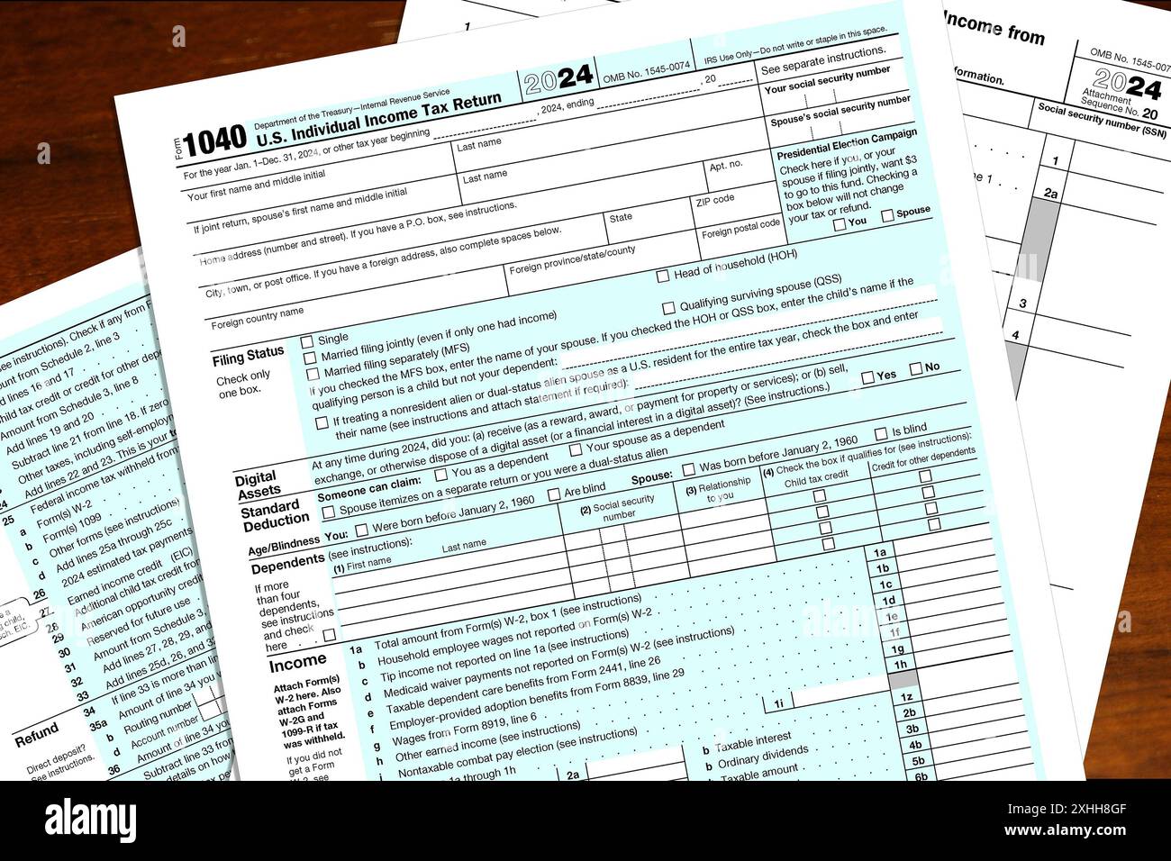 2024 IRS tax forms lay on a desktop Stock Photo - Alamy