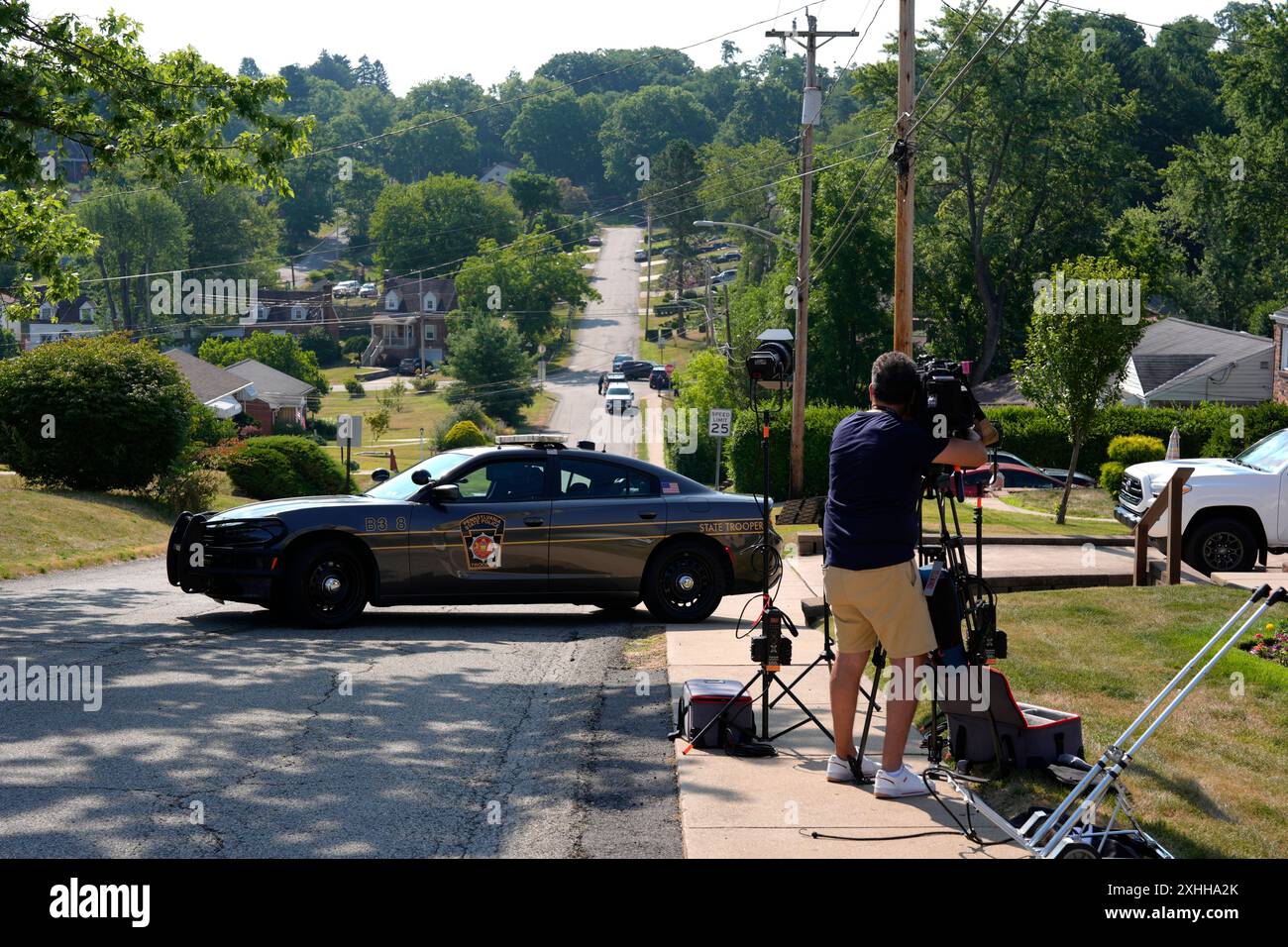 Law enforcement block a street in Bethel Park, Pa., that they say is ...
