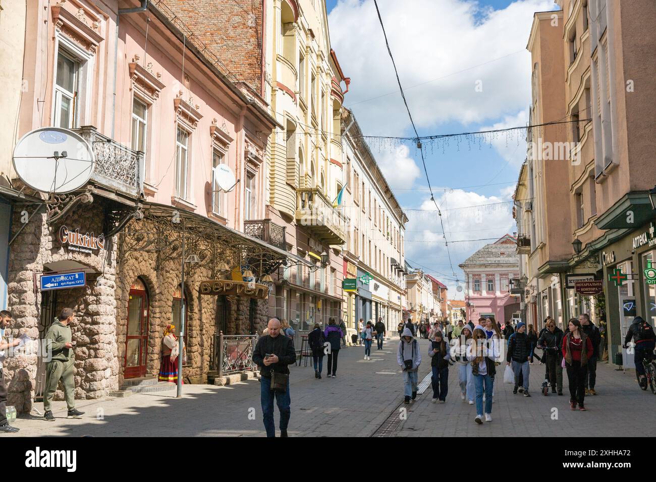 Uzhhorod, Ukraine - April 19, 2024: People walk along Korzo street ...
