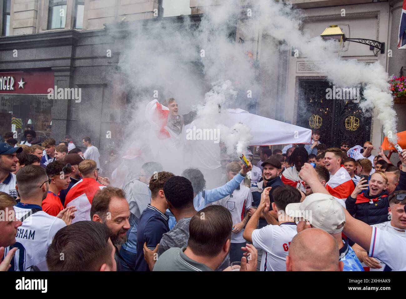 London, UK. 14th July, 2024. England fans set off smoke flares outside ...