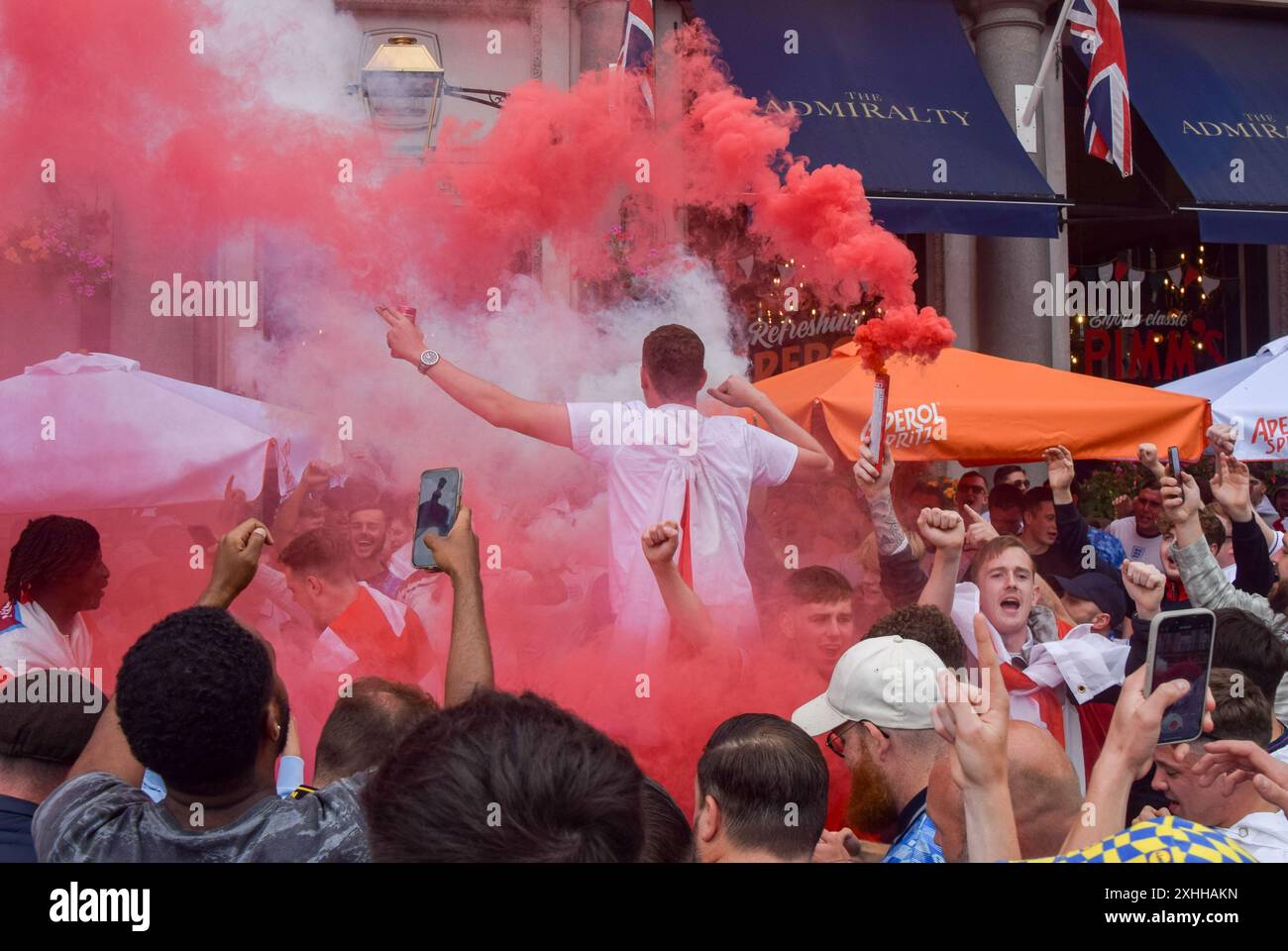 London, UK. 14th July, 2024. England fans set off smoke flares outside ...