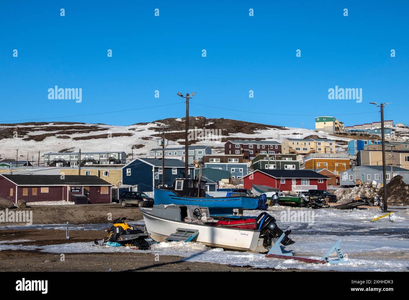 Boats and snowmobile stored on the beach on Frobisher Bay in Iqaluit, Nunavut, Canada Stock ...