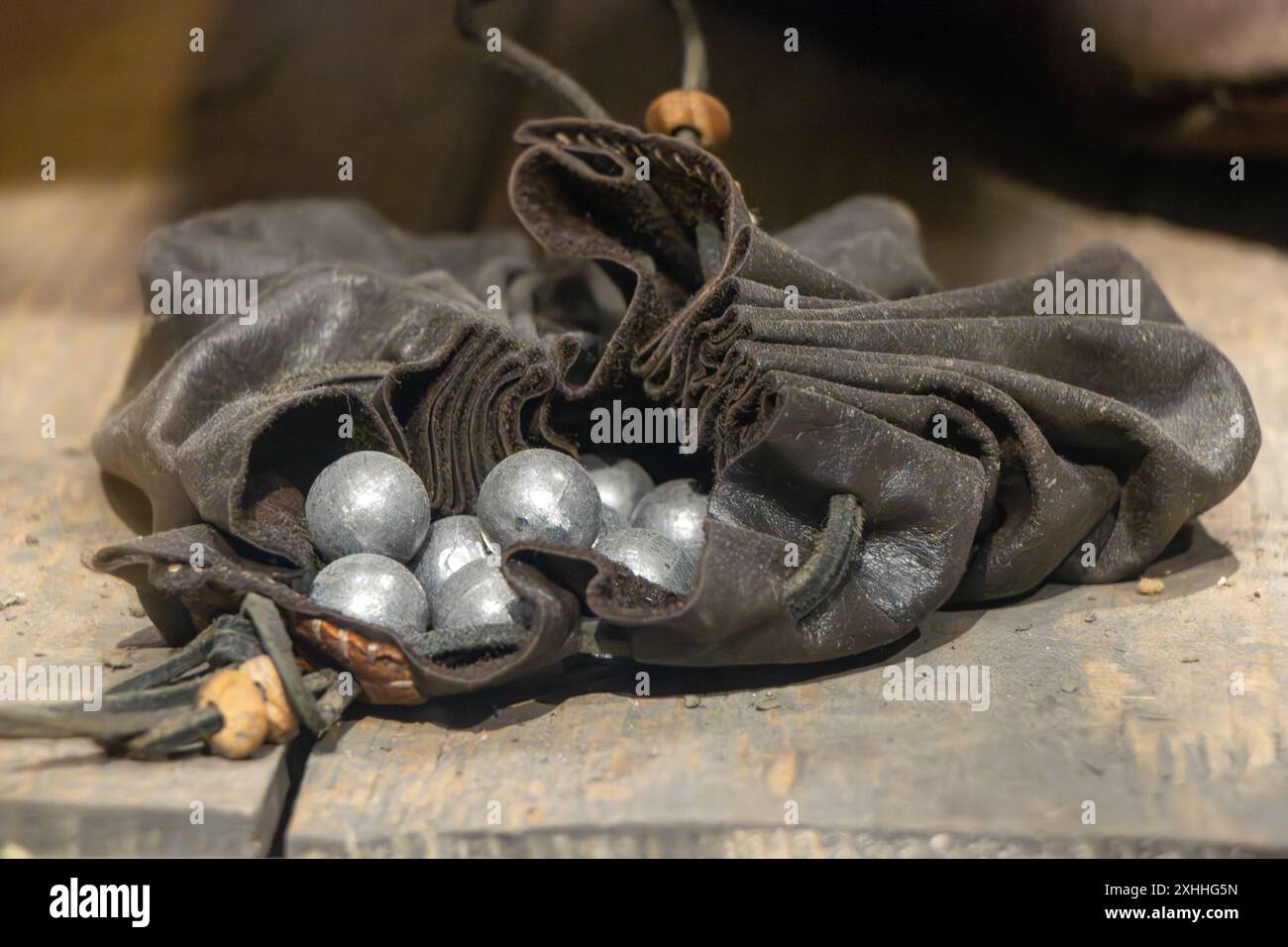 Bullets for a medieval firearm in a small leather sack Stock Photo - Alamy
