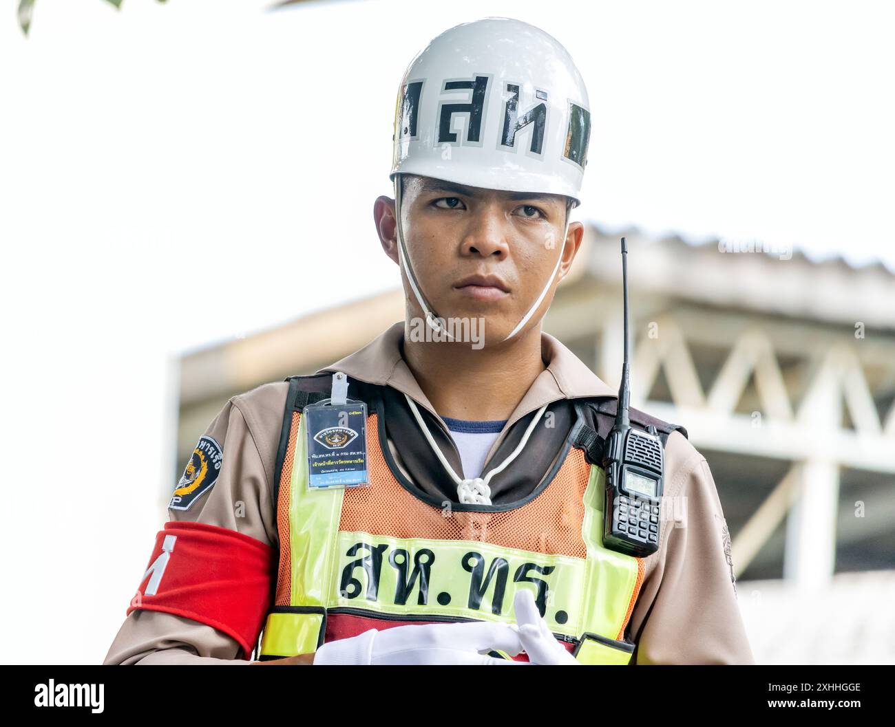 BANGKOK, THAILAND, JUNE 16 2024, A naval military police officer directs traffic on the street ...