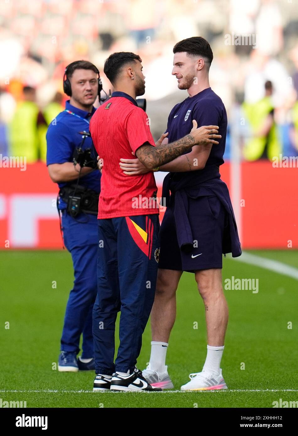 England's Declan Rice (right) greets club mate, Spain goalkeeper David ...