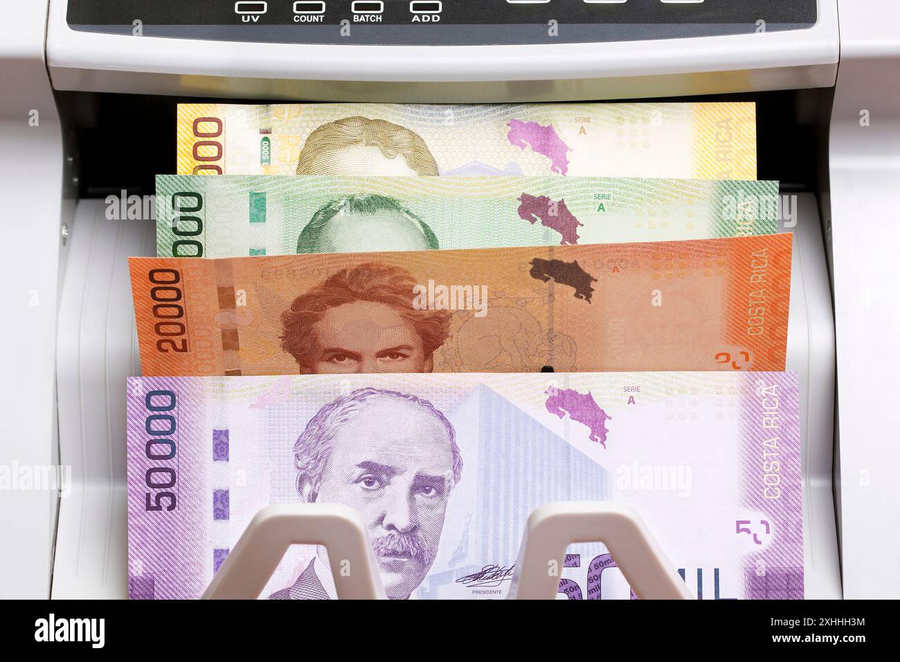 Costa Rican money - colon in the counting machine Stock Photo - Alamy