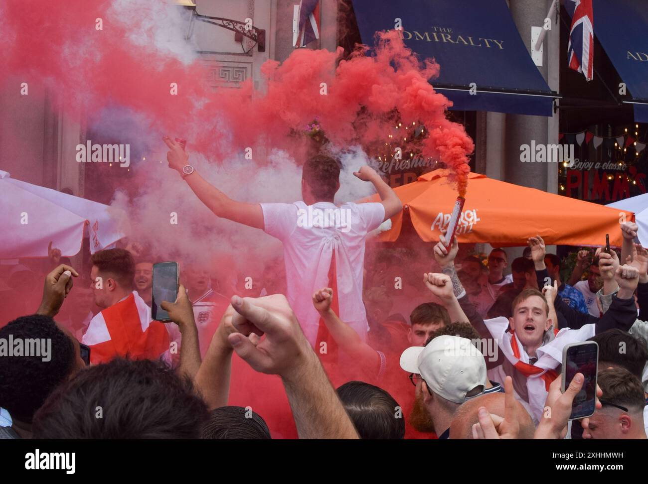 London, UK. 14th July 2024. England fans set off smoke flares outside ...