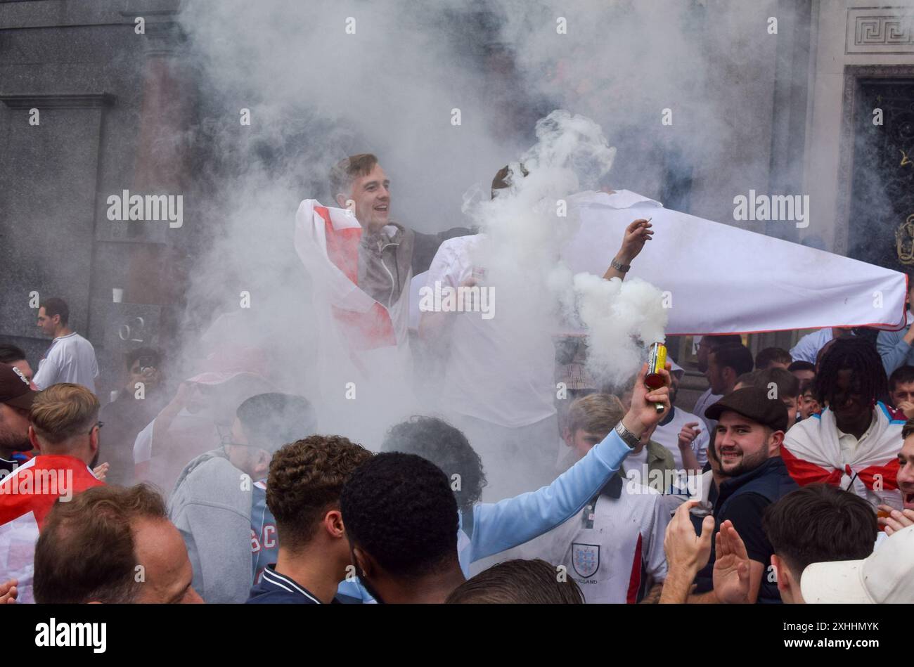 London, UK. 14th July 2024. England fans set off smoke flares outside ...